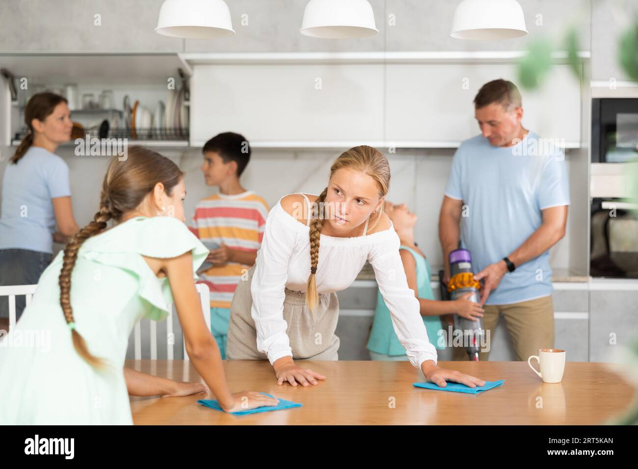 Big family members cleaning their house Stock Photo - Alamy