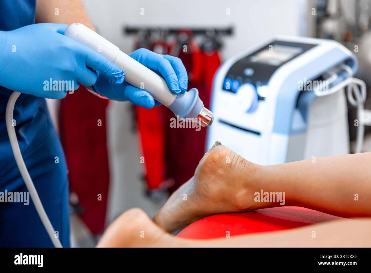Physical therapy of foot with acoustic shock waves, close up Stock ...