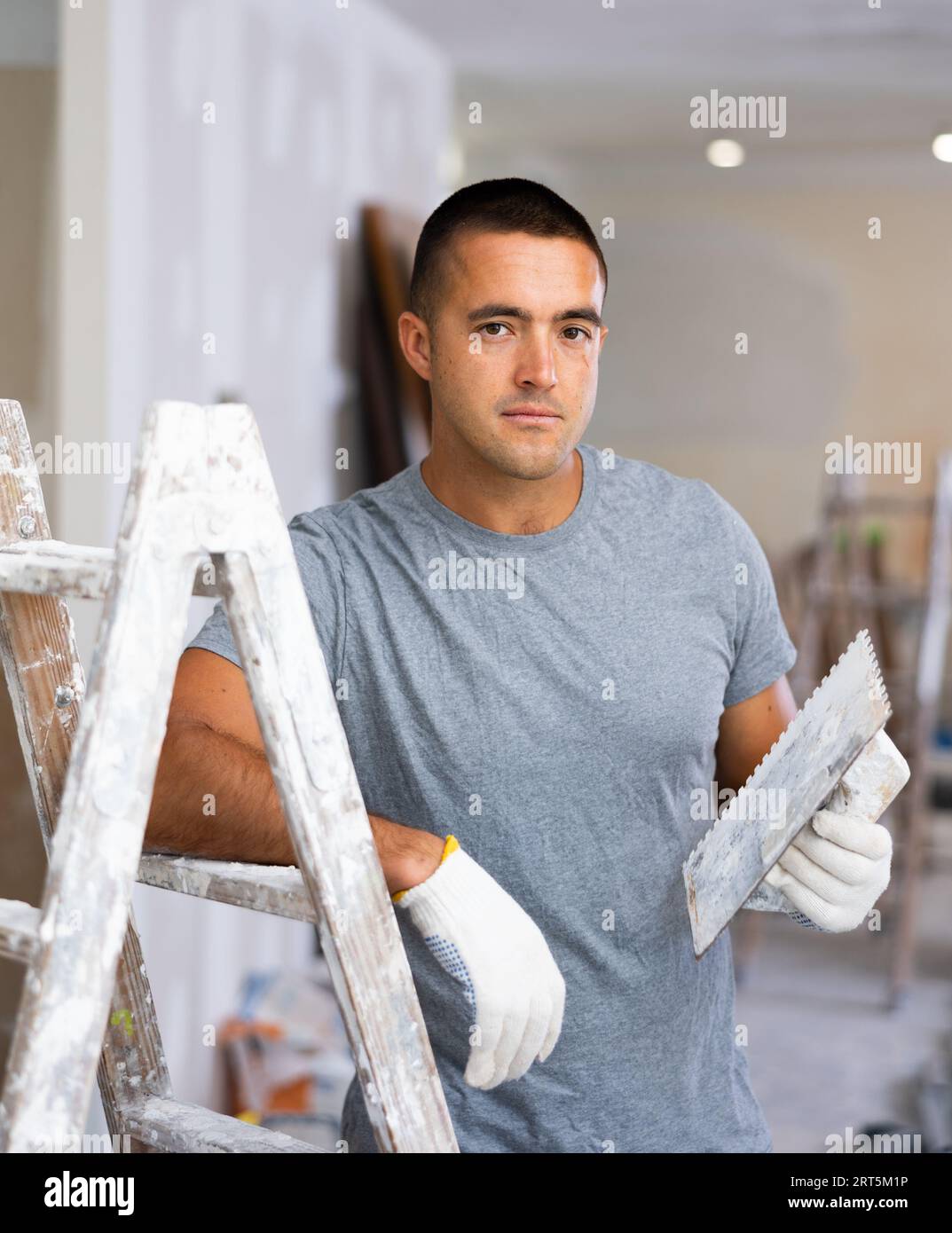 Portrait of man in construction site with working tool Stock Photo - Alamy