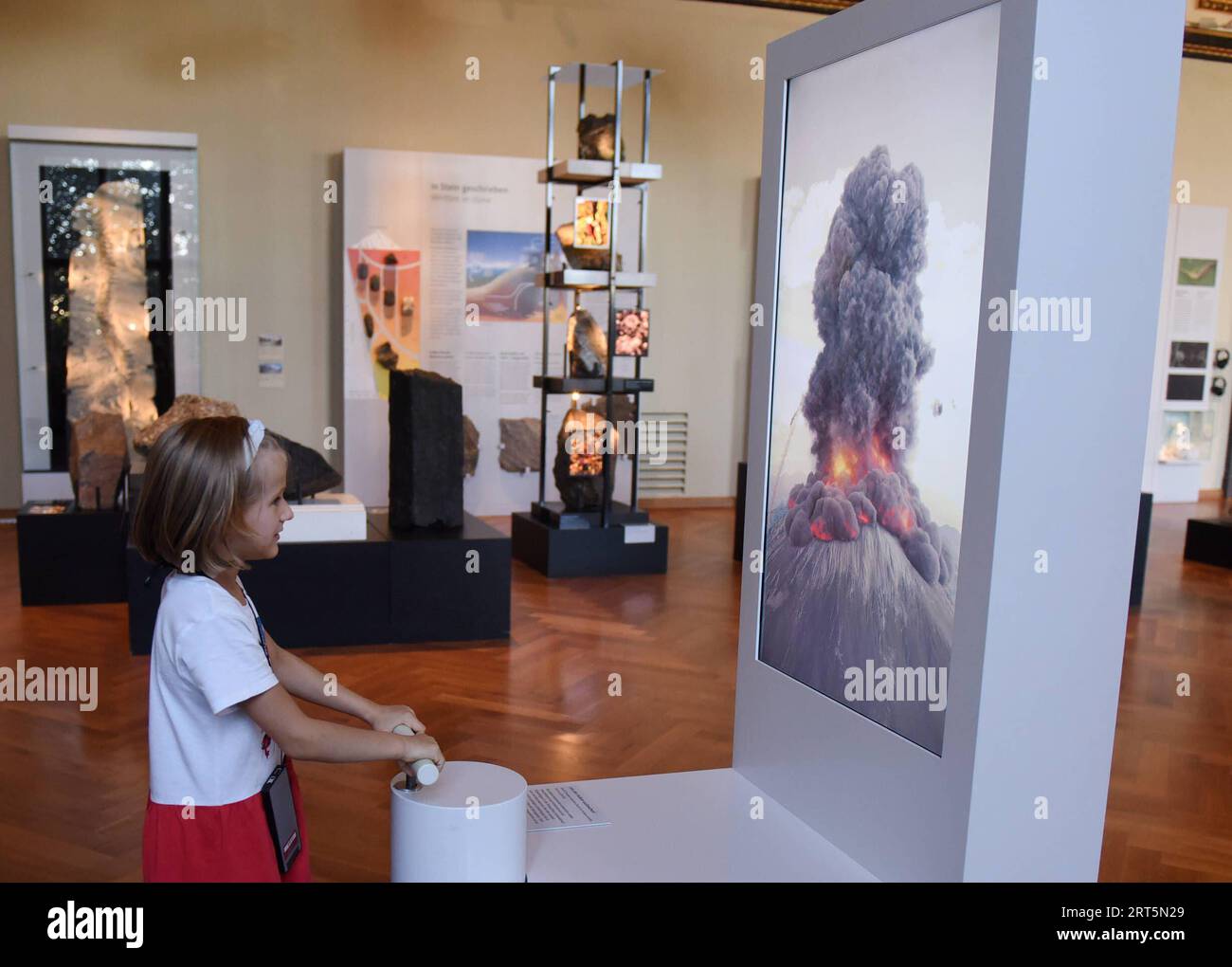 230908 -- VIENNA, Sept. 8, 2023 -- A young girl tries an interactive ...