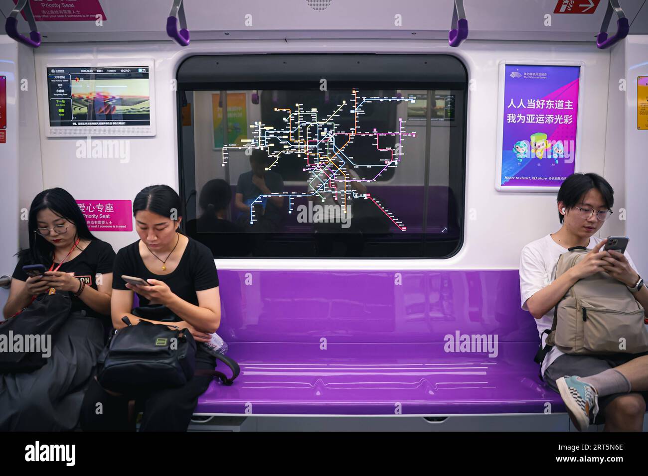 230908 -- HANGZHOU, Sept. 8, 2023 -- People ride a subway train adorned ...