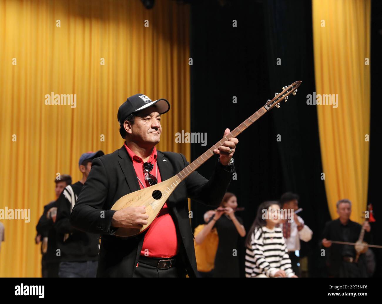 230908 -- TAXKORGAN, Sept. 8, 2023 -- An artist of a local art troupe ...