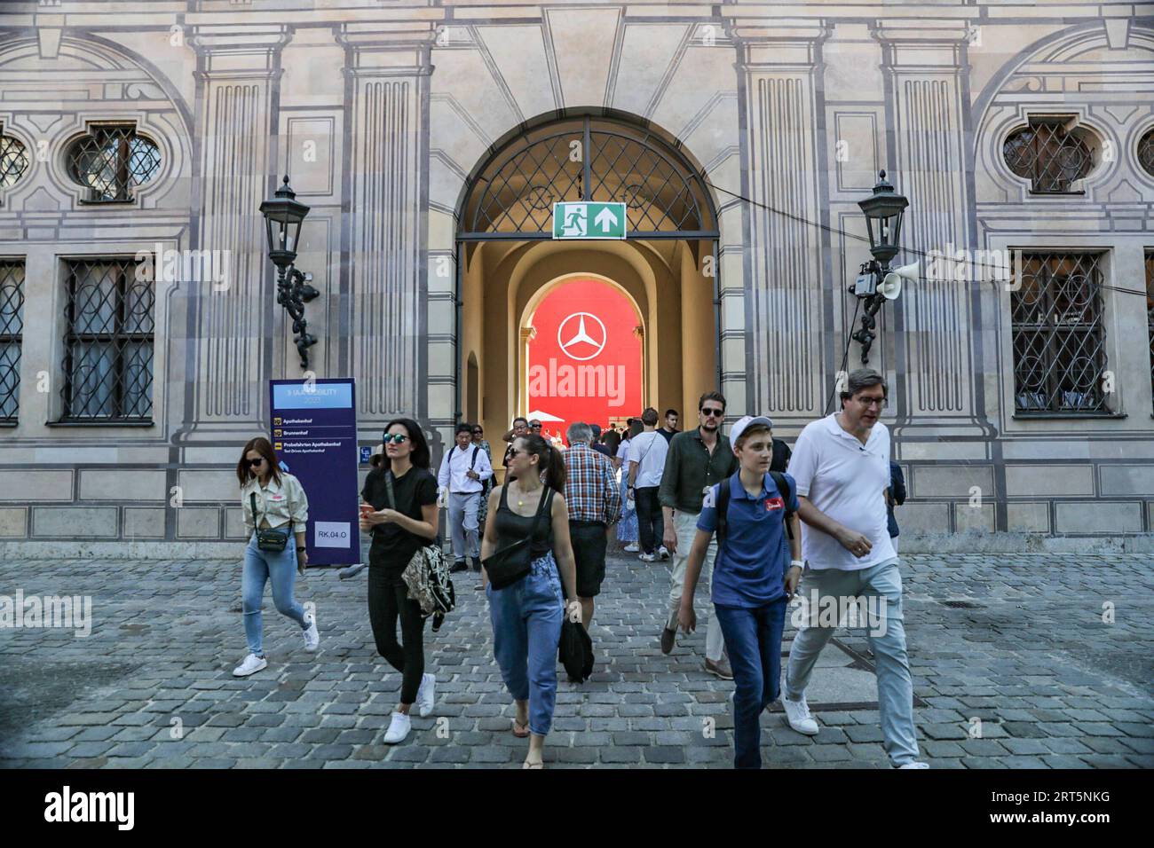230908 -- MUNICH, Sept. 8, 2023 -- People leave the Mercedes-Benz booth ...