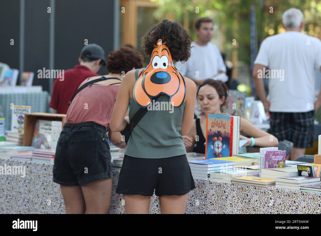 230908 -- BRUSSELS, Sept. 8, 2023 -- A person with a comic mask visits ...