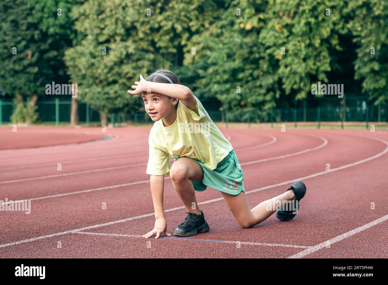 Child fitness, teenager girlsrunning on stadium track Stock Photo - Alamy