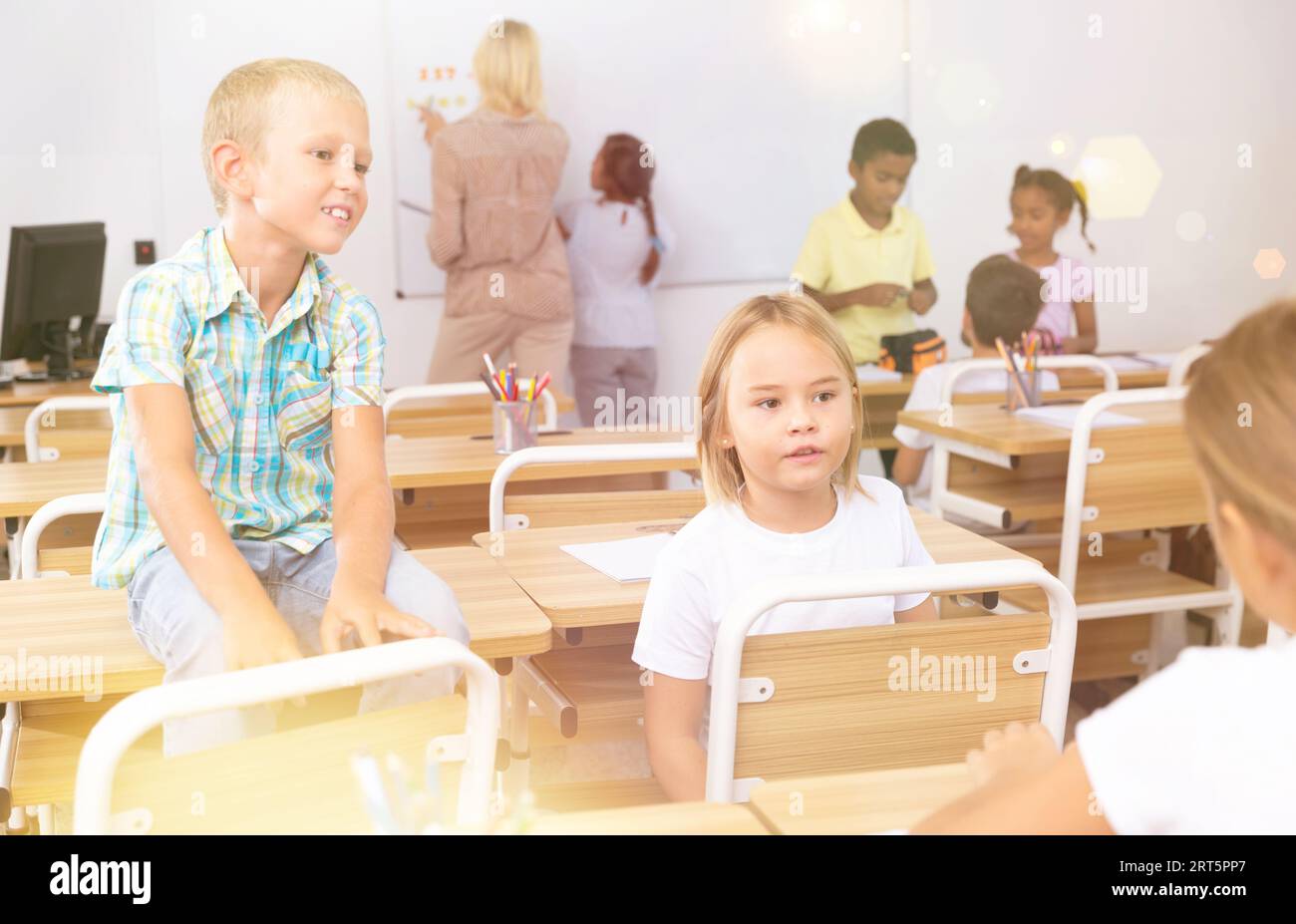 Kids pupils talking during recess between lessons Stock Photo - Alamy