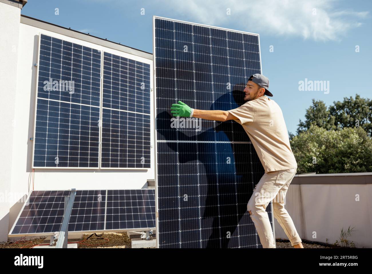 Technician installing solar panels alternative hi-res stock photography ...