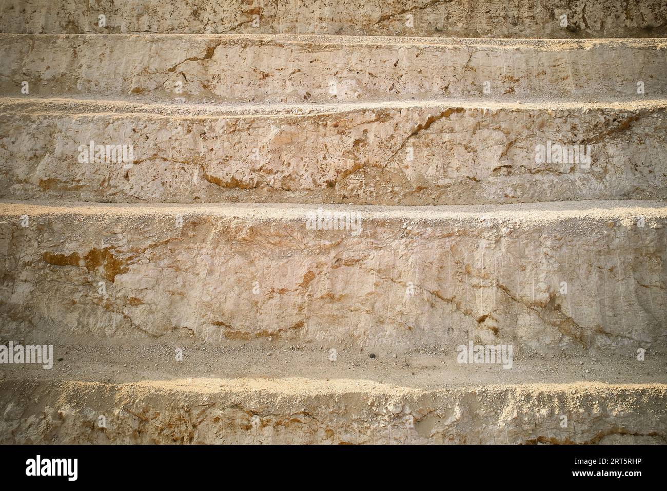 Ledges of a quarry after blasting and drilling operations. Aerial view ...