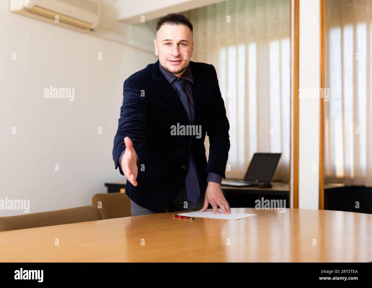 Business partner reaching out handshake hi-res stock photography and ...