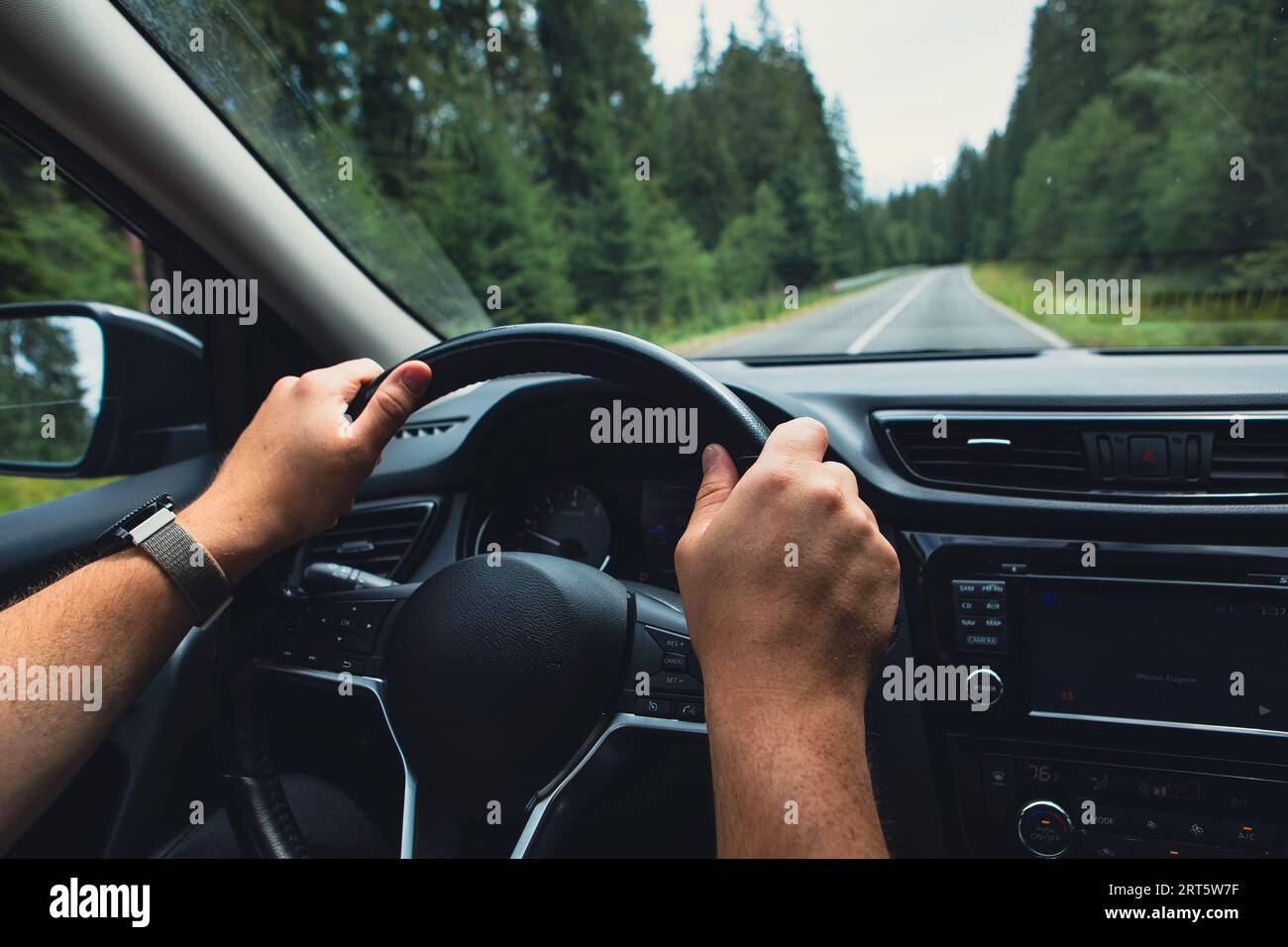 man hands on steering wheel Stock Photo - Alamy