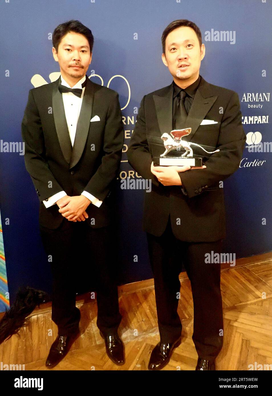 Japanese film director Ryosuke Hamaguchi (R) starring Hitoshi Omika poses for a photograph after ...