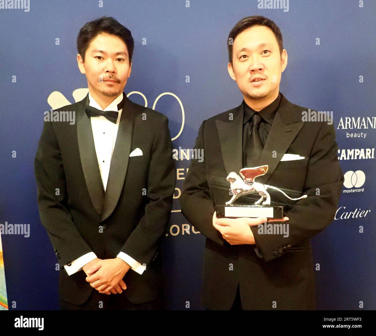 Japanese film director Ryosuke Hamaguchi (R) starring Hitoshi Omika poses for a photograph after ...