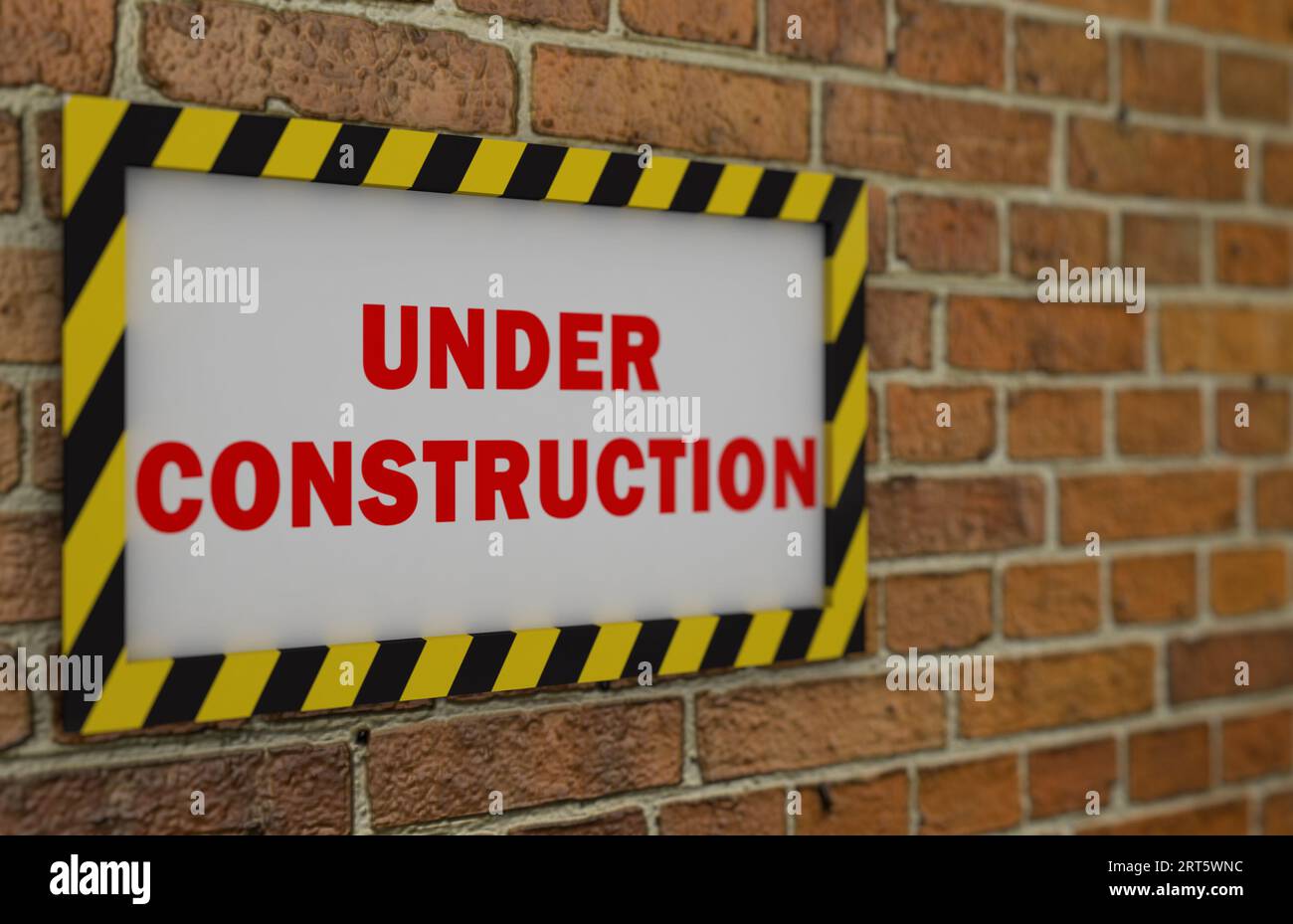 Under construction sign on a brick wall Stock Photo - Alamy