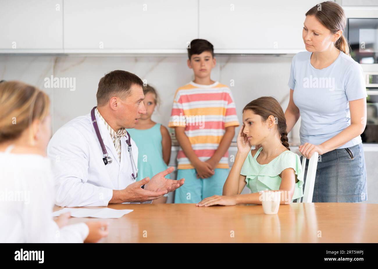 Family male doctor visit at home. Doctor examining children Stock Photo ...