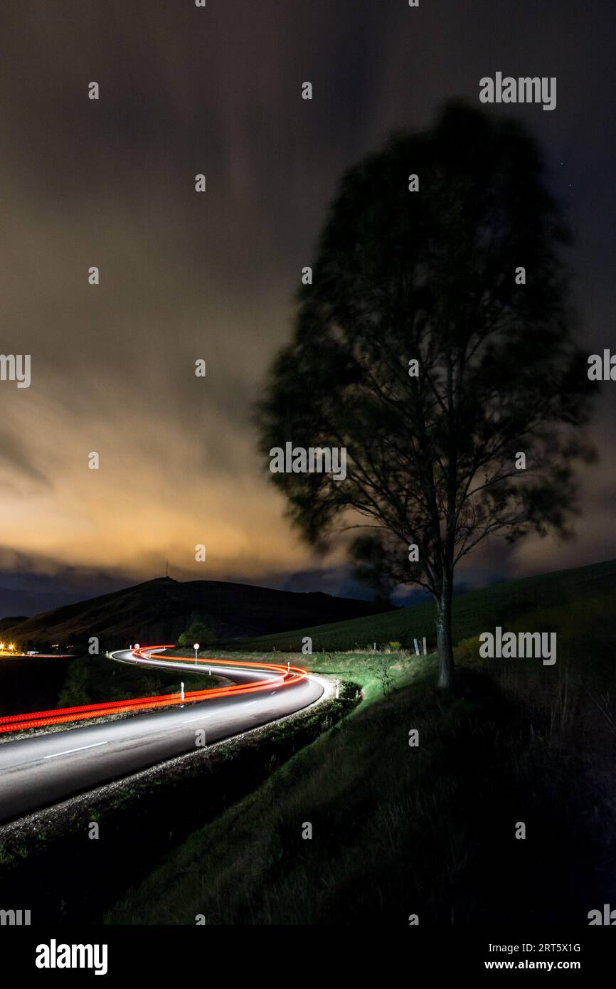 Traffic light line on the road at night Stock Photo - Alamy
