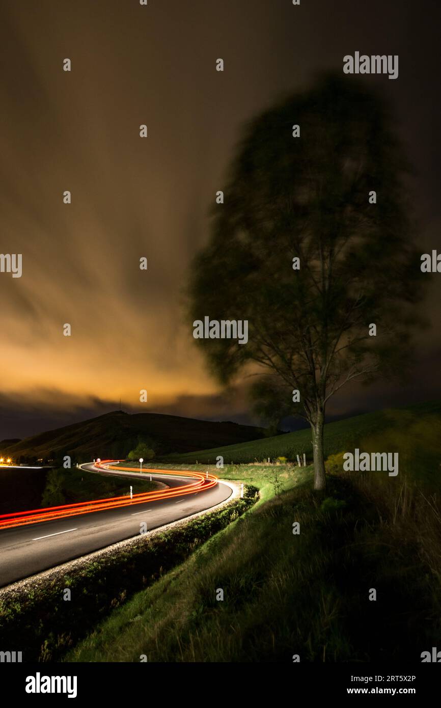 Traffic light line on the road at night Stock Photo - Alamy