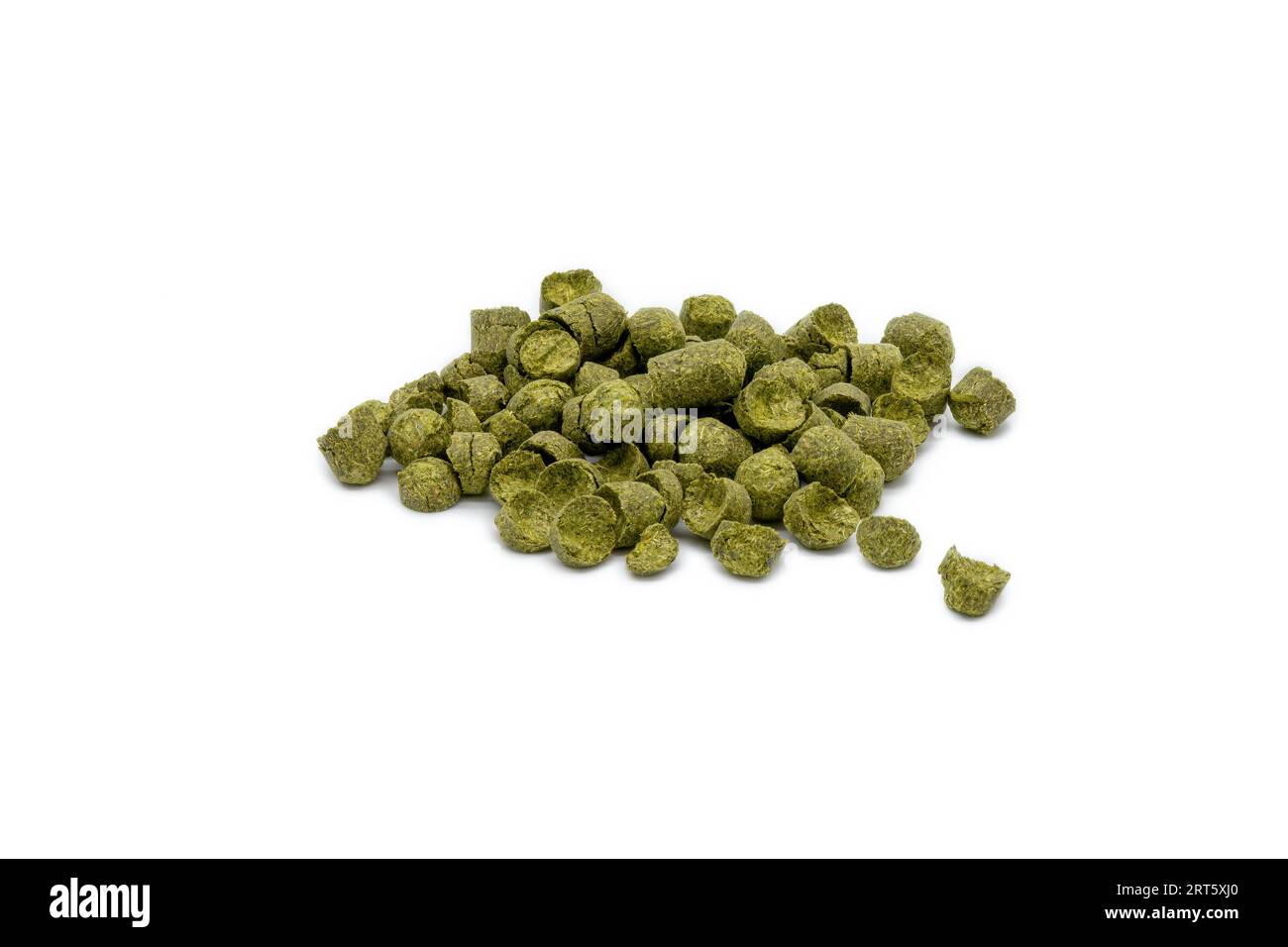 Pile of hop pellets on white background Stock Photo - Alamy