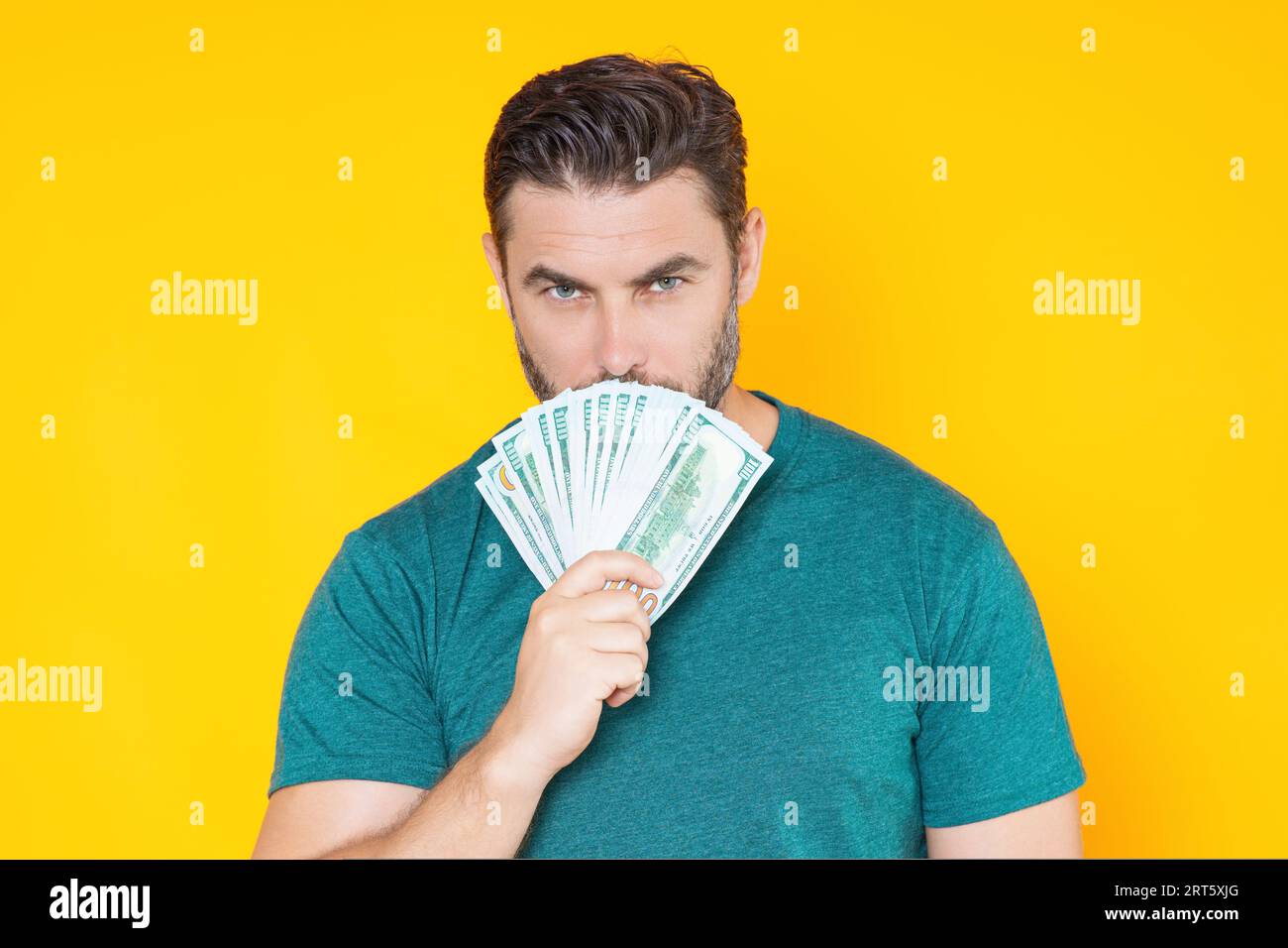 Man with money cash. Dollar banknotes. Portrait of man holding bunch of ...