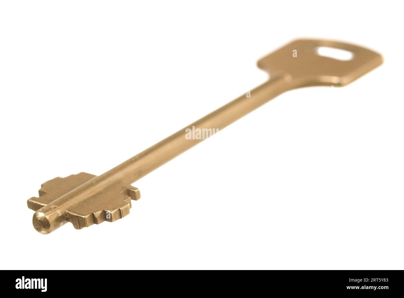 Yellow brass key isolated on white. Low DOF Stock Photo - Alamy
