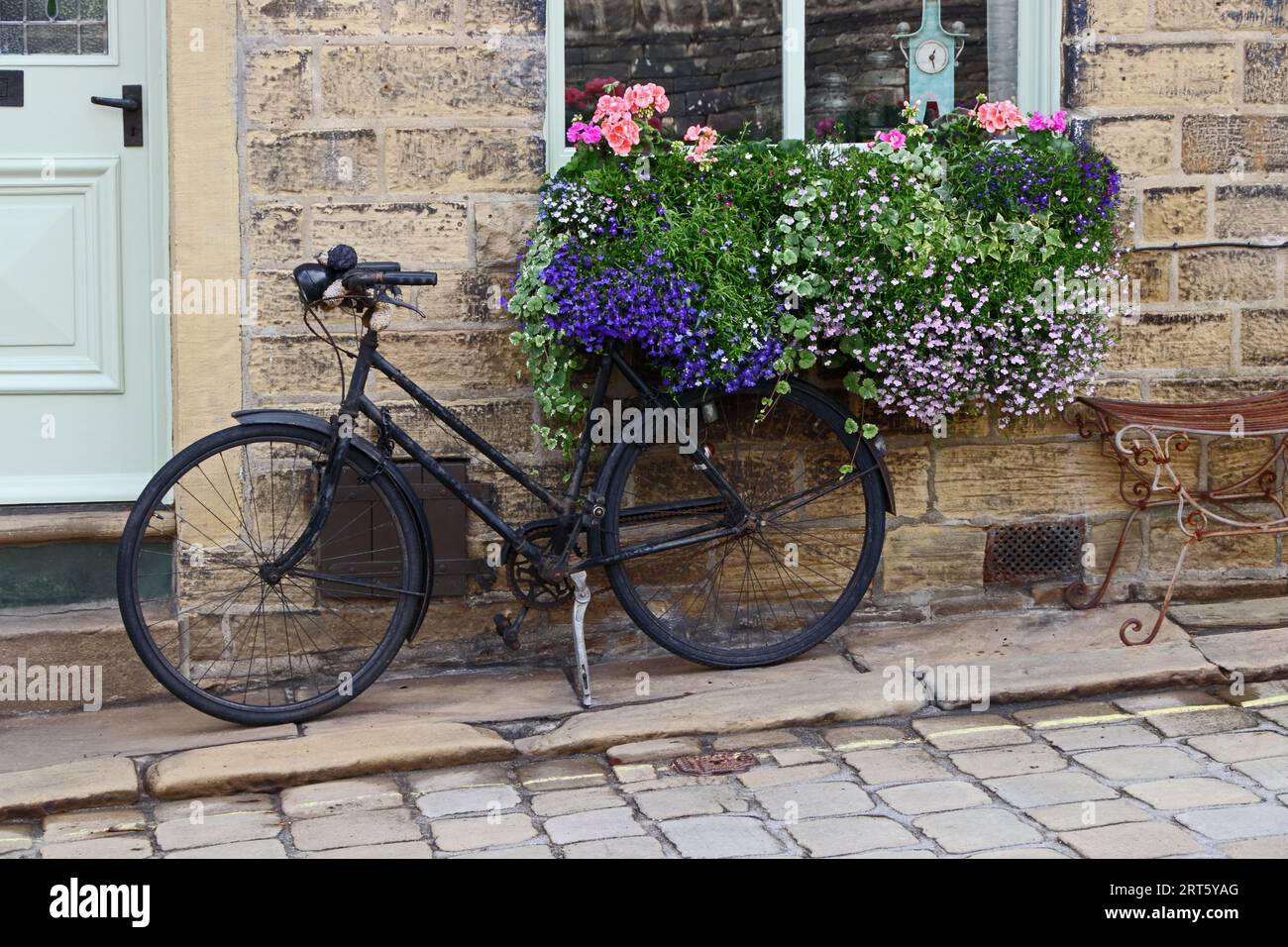 Bicycle under window box, Haworth Stock Photo - Alamy