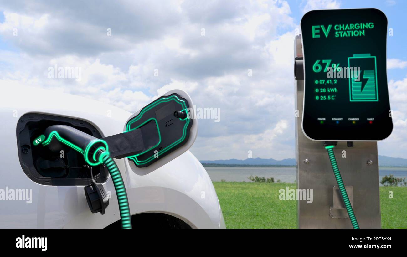 Electric car plugged in with charging station to recharge battery by EV ...