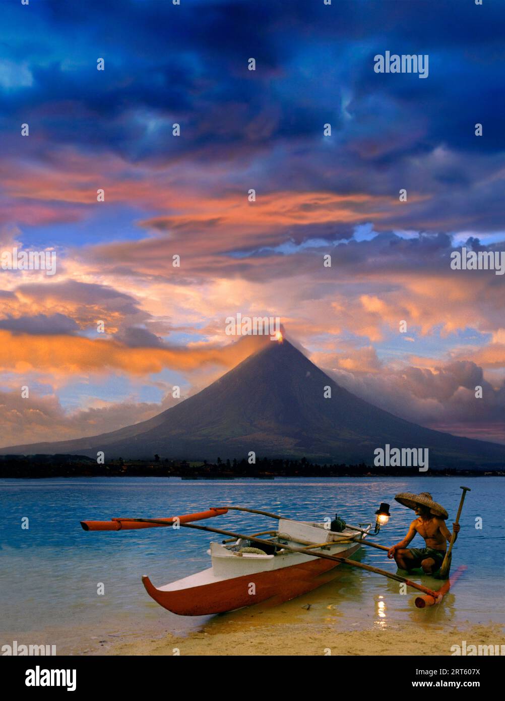 Fisherman near Mayon Volcano near Legazpi City, Philippines Stock Photo ...