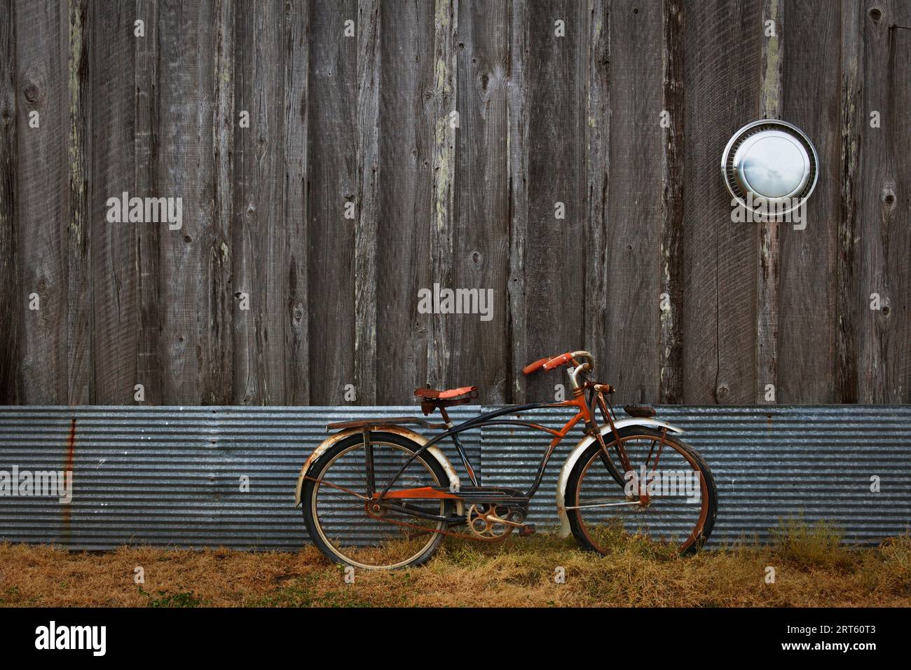 Old cruiser bike leaning against old wooden building Stock Photo - Alamy