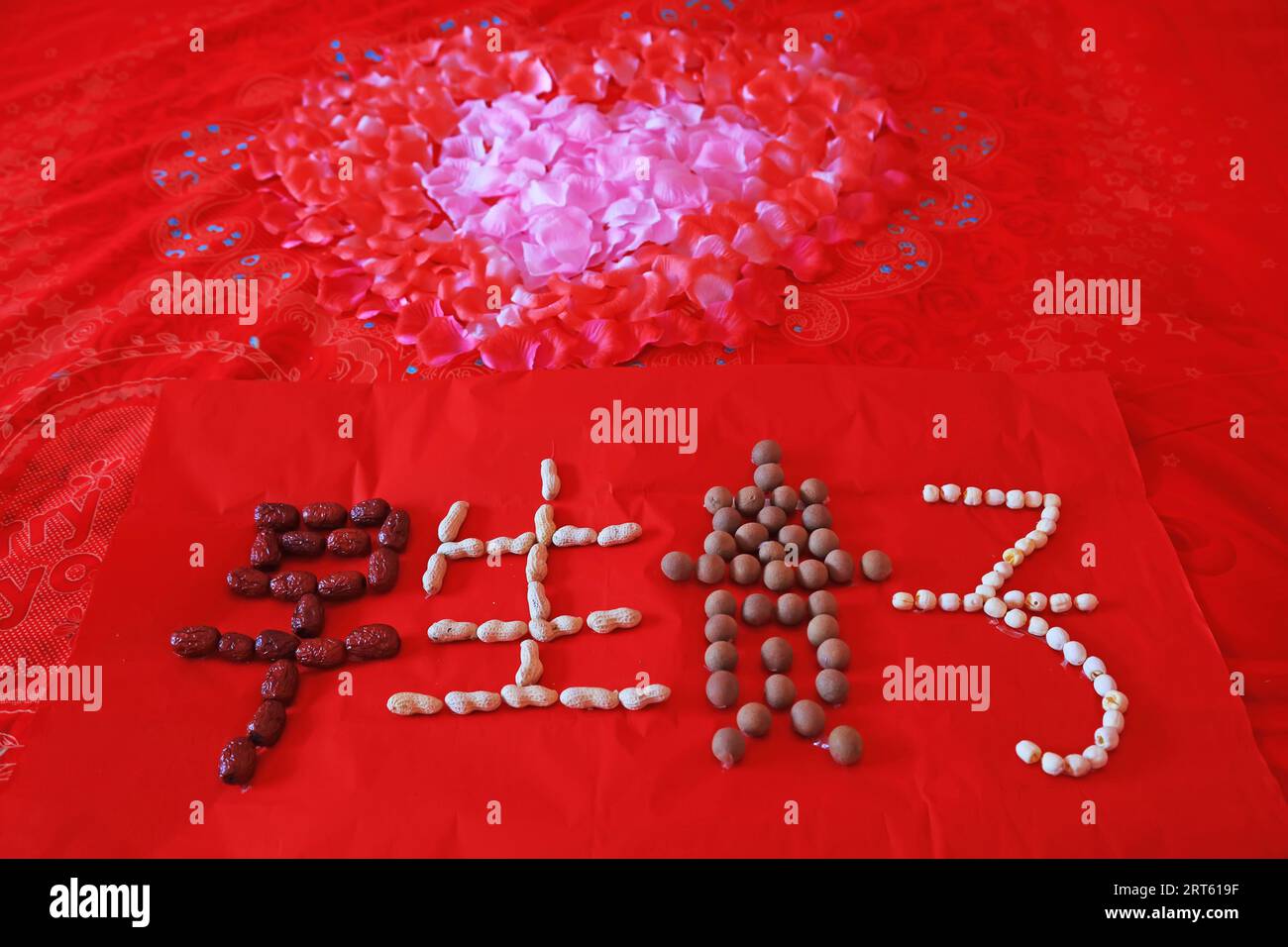 Chinese Wedding, word "Early Birth Guizi" in Bed Stock Photo - Alamy