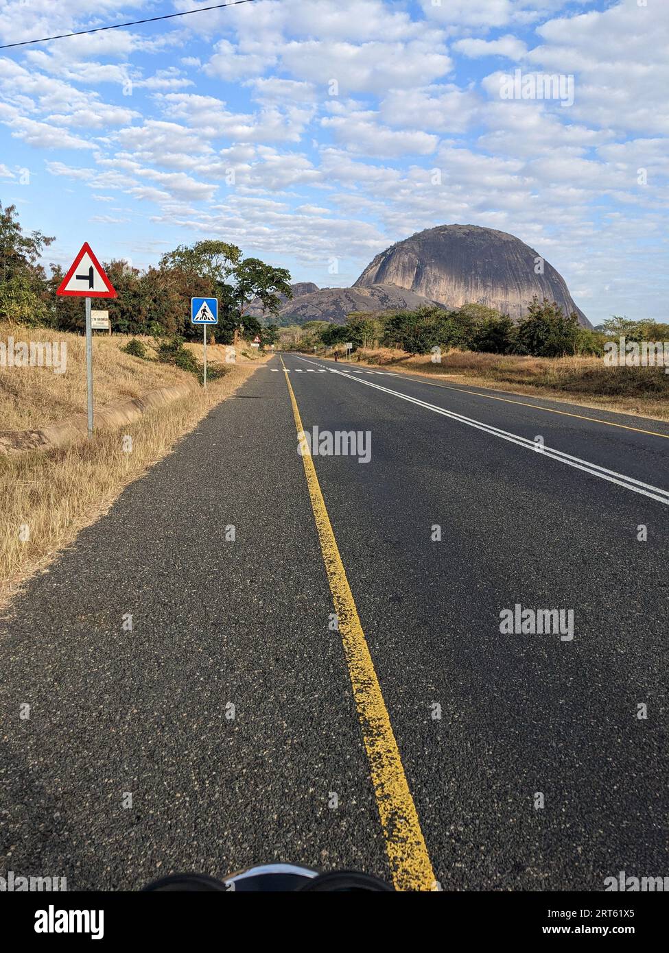 An overhead view of two road signs positioned at the side of a street ...