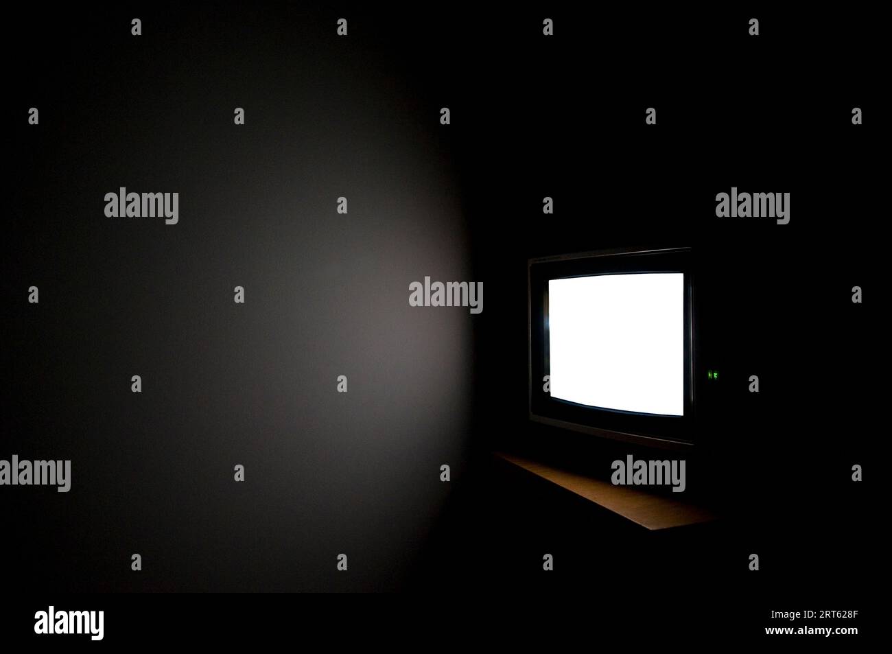 Television set glowing in a dark room Stock Photo - Alamy