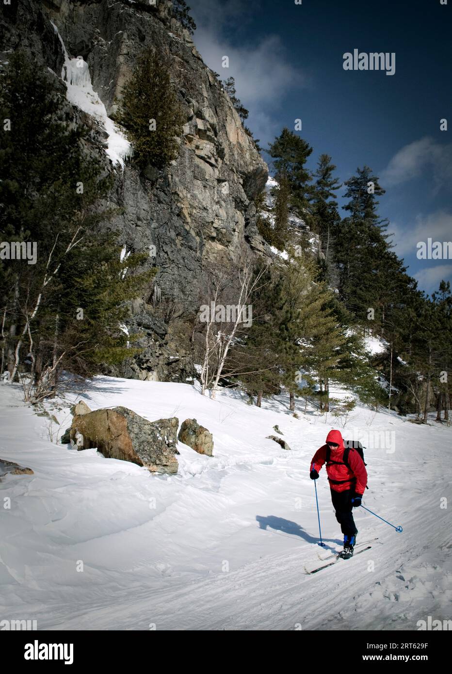 Skiing on Moosehead Lake below the lower cliffs of Mount Kineo, Maine ...