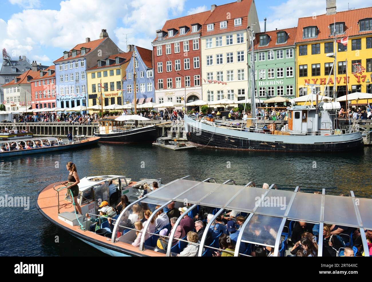 Tourist boats on the Nyhavn canal in Copenhagen, Denmark Stock Photo ...