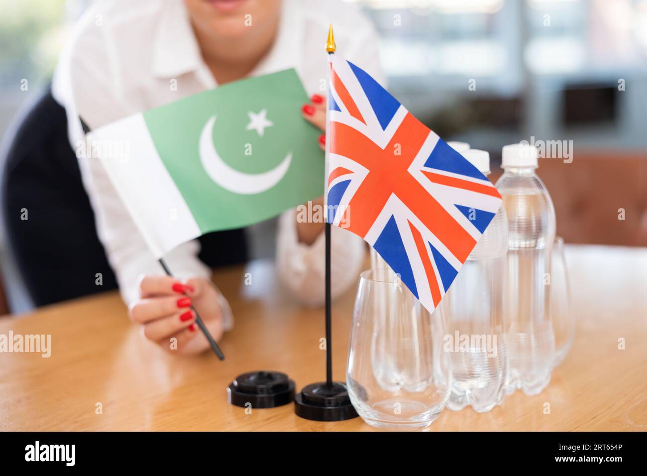 National flag of Pakistan and United Kingdom on meeting table Stock ...