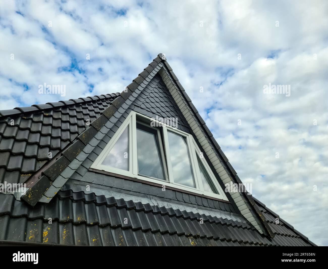 Open Roof Window In Velux Style With Black Roof Tiles Stock Photo - Alamy