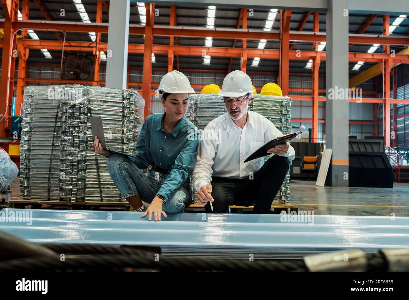 Metalwork manufacturing factory manager inspect newly manufactured ...
