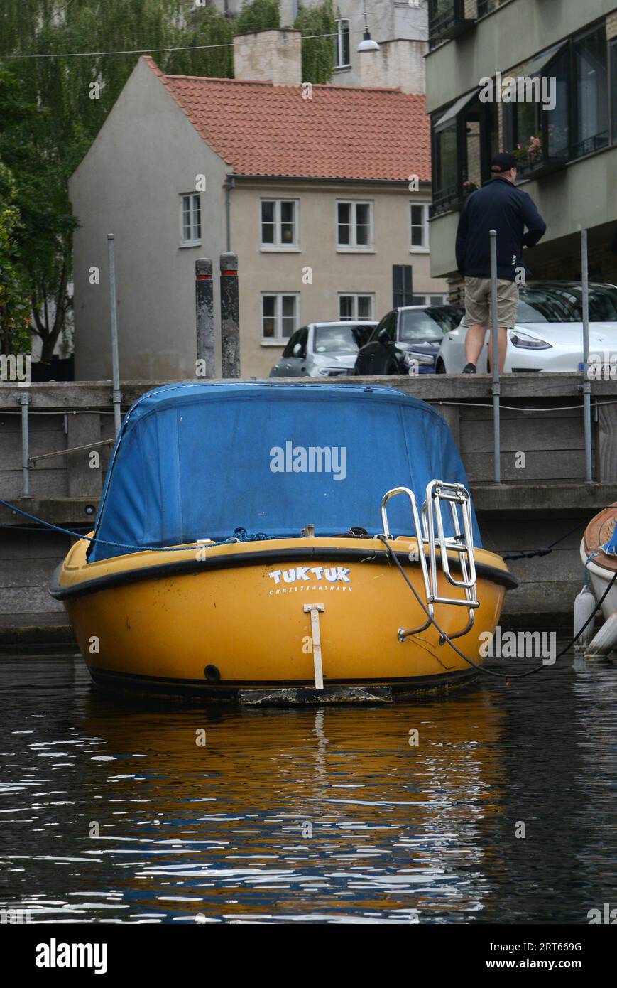 A Yellow & Blue TukTuk boat docking in the Christianshavns canal in ...