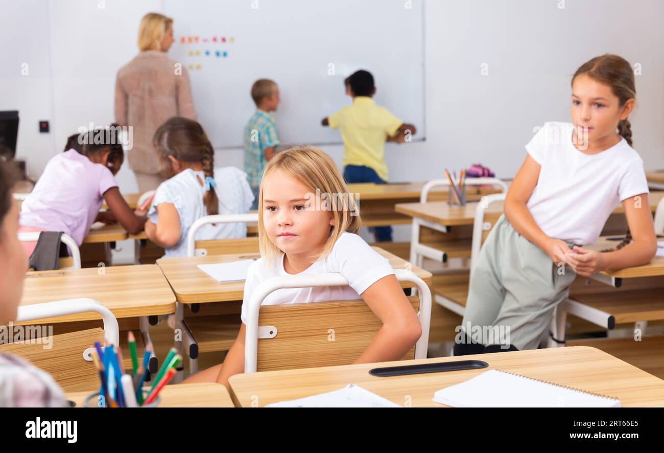 Kids pupils talking during recess between lessons Stock Photo - Alamy