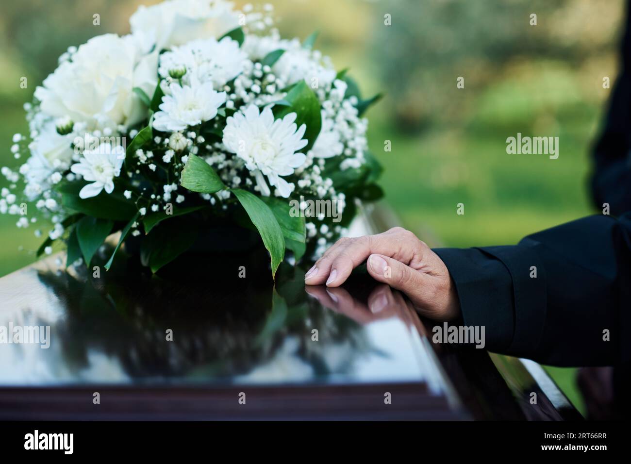 Hand on the coffin hi-res stock photography and images - Alamy