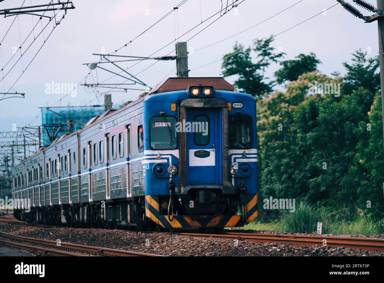 A blue electric shuttle train on Taiwan railway Stock Photo - Alamy