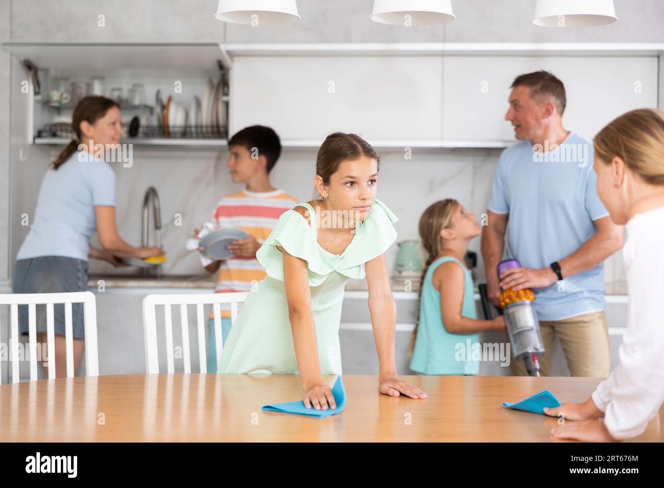 Big family members cleaning their house Stock Photo - Alamy