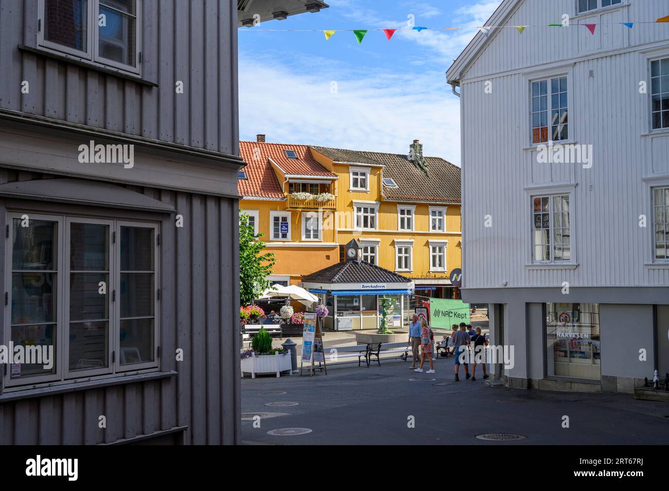 View to the town square in between wooden houses in the well kept and ...