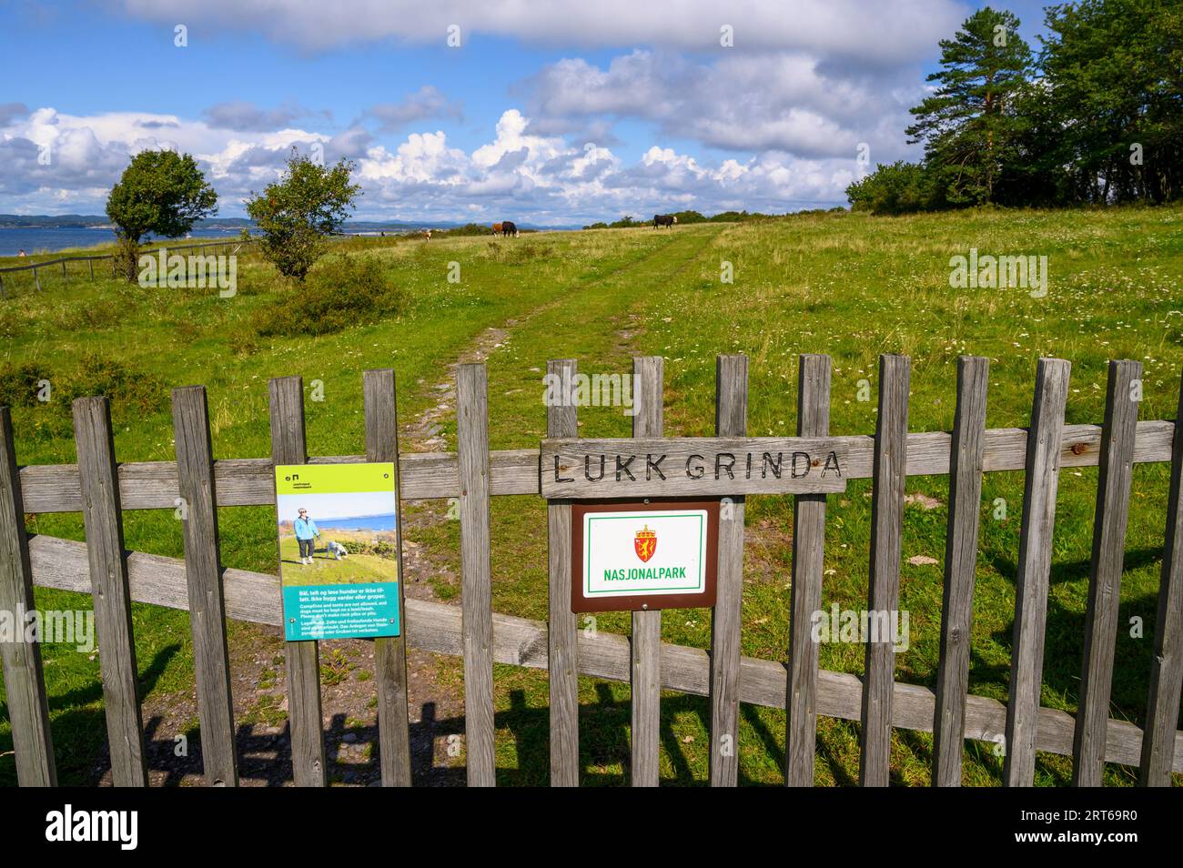 "Keep the gate closed". Sign on a wooden gate for the entrance to a ...