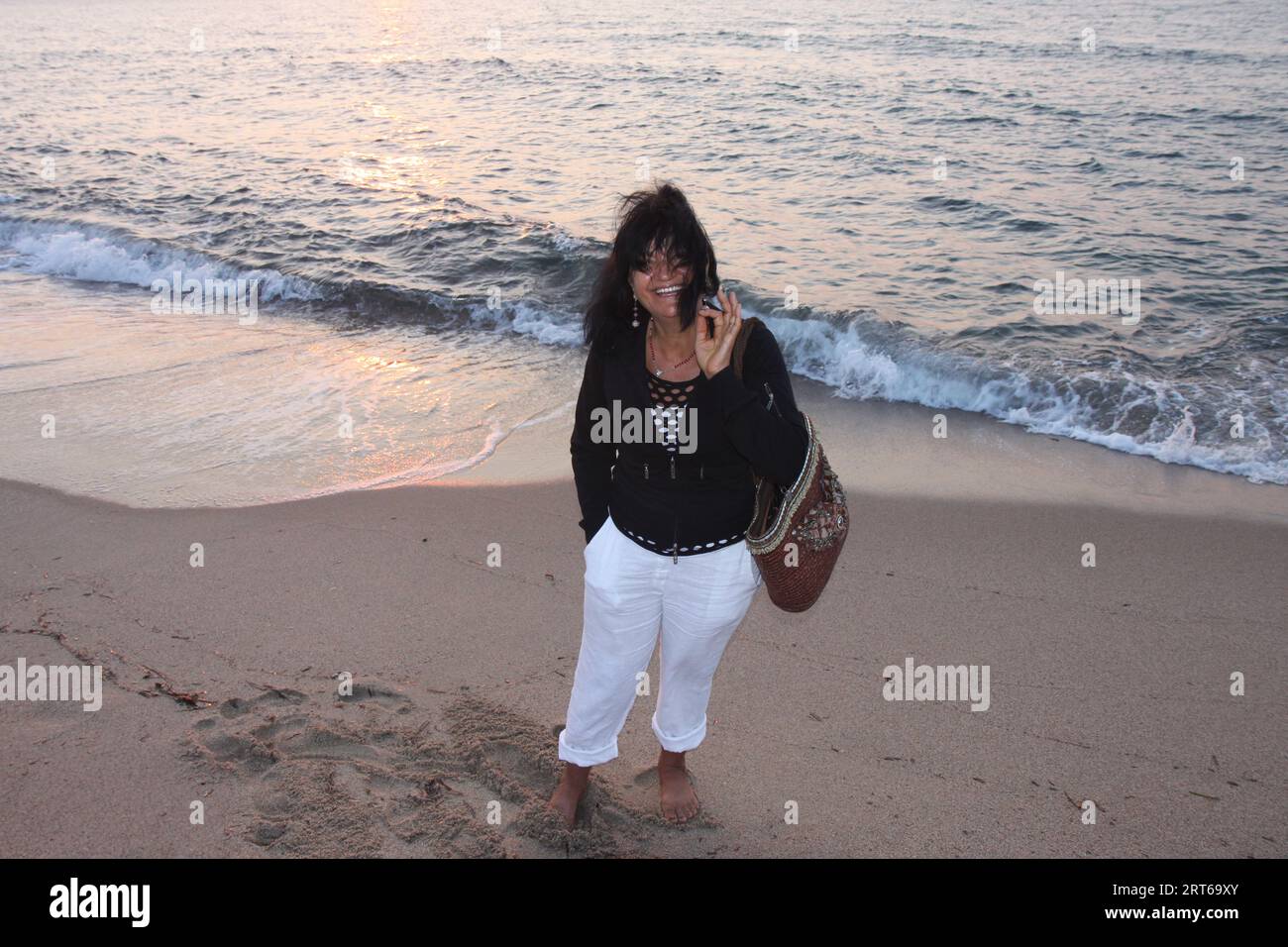 old woman walks on the cliff Pantelleria Italy Stock Photo - Alamy