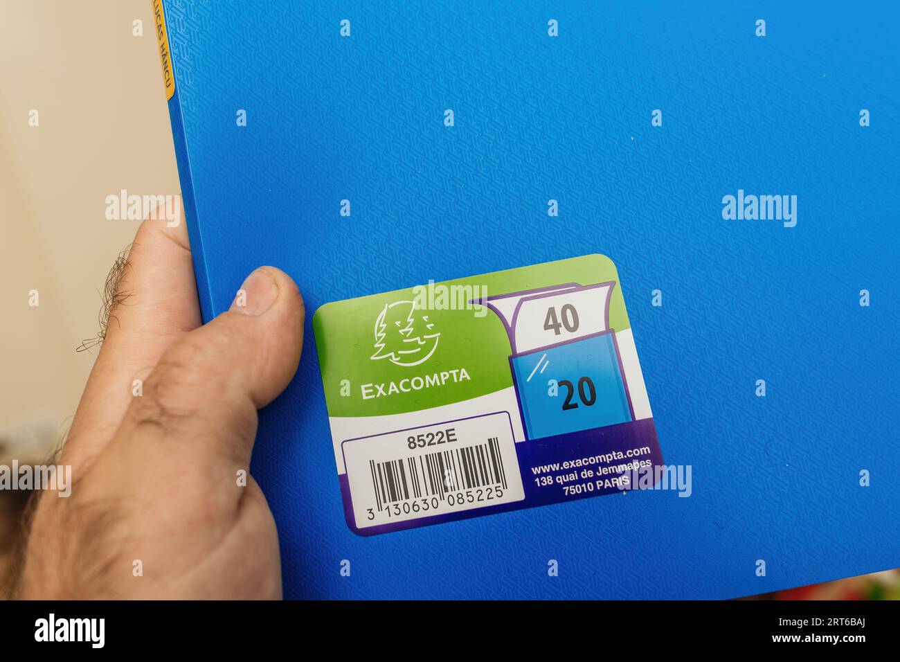 Paris, France - Sep 2, 2023: In a close-up, a male hand securely holds ...