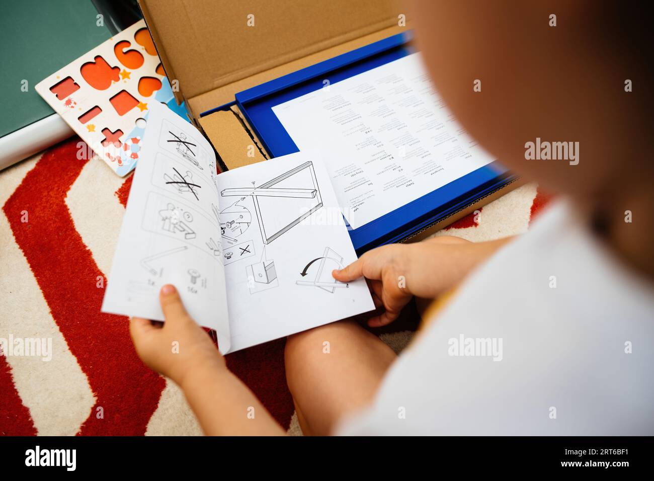 Paris, France - Jul 29, 2023: POV toddler hands holding IKEA Knarrevik ...