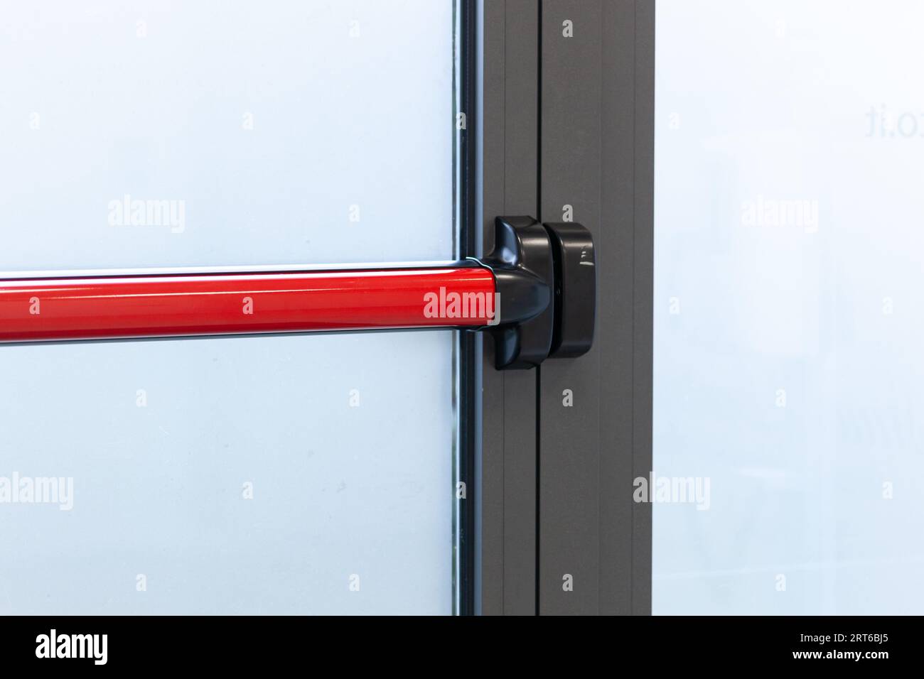 Red panic bar. Mandatory safety handle in public places Stock Photo - Alamy