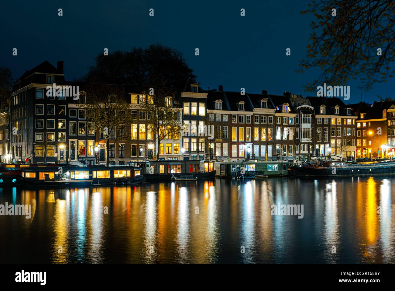 Illuminated Canals and Riverside Delights: Exploring Amsterdam After ...