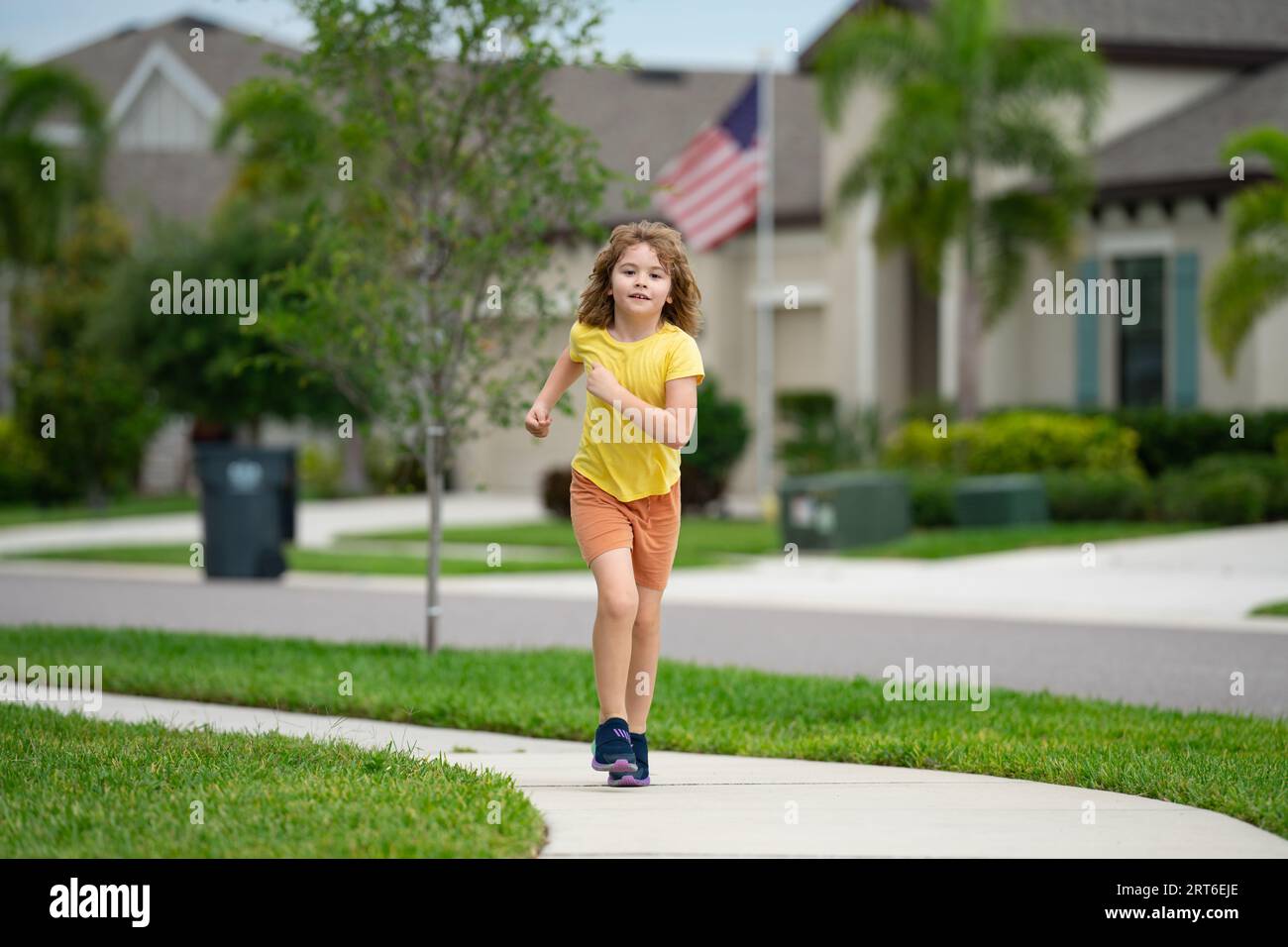 Kid running in summer street. Child enjoy run. Little boy running on ...