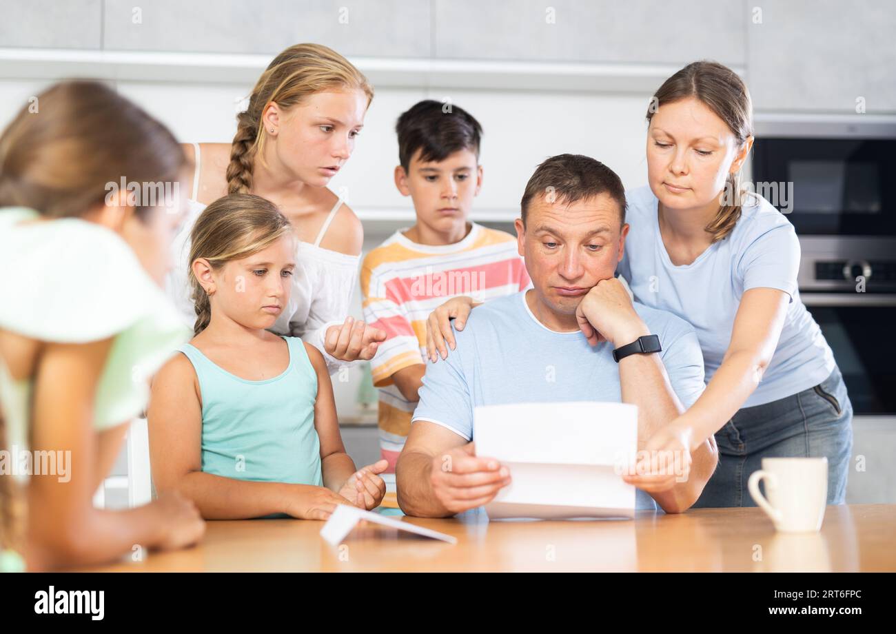 Man family wife children home unhappy hi-res stock photography and ...
