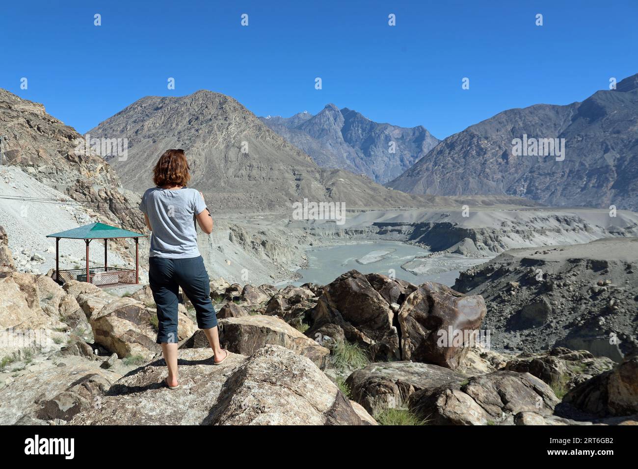 Tourist at the viewpoint for three mountain ranges in northern Pakistan ...